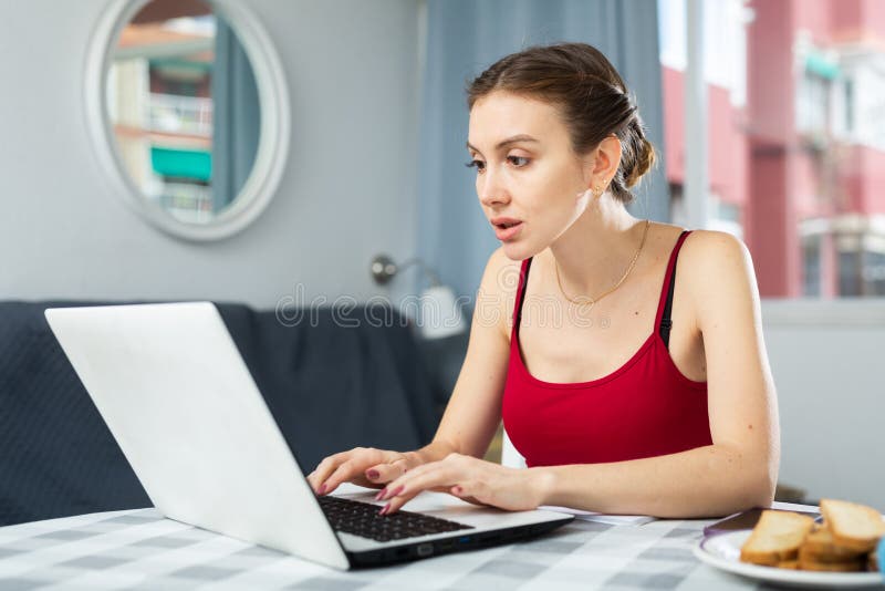 Woman Communicates Over Internet Using Laptop at Home Stock Image ...