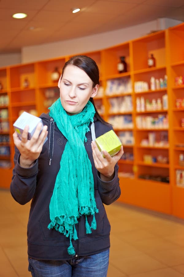 Woman comparing products stock image. Image of medication - 21748093