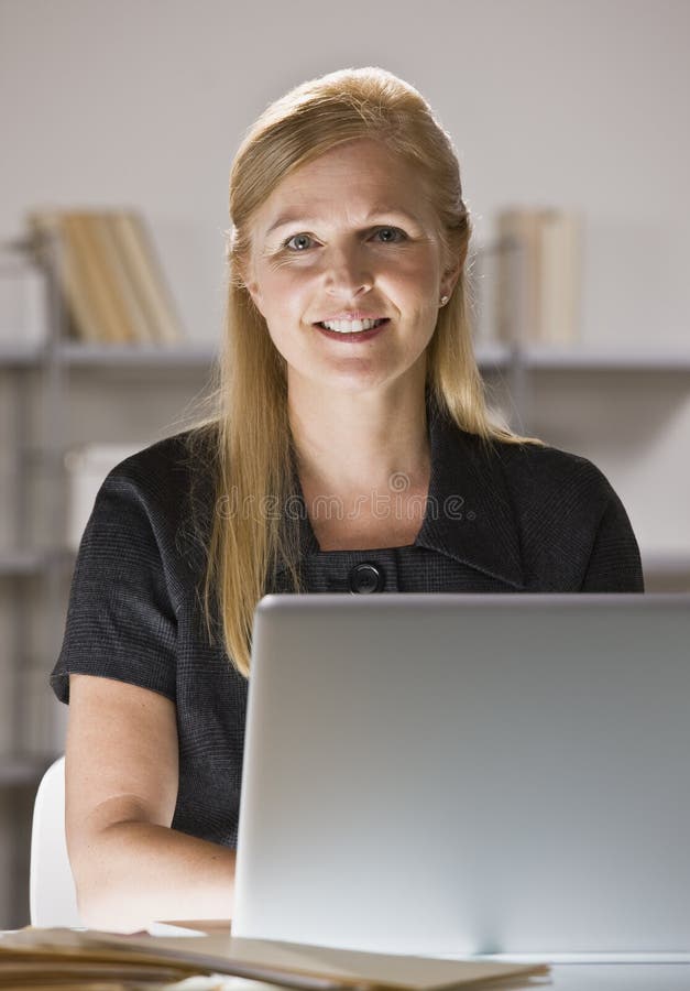 Woman Looking through Filing Cabinet Stock Photo - Image of ...