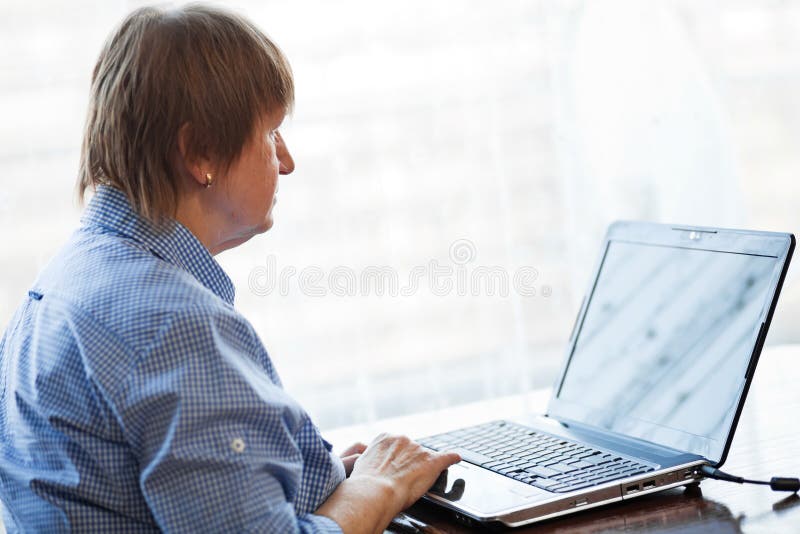 Woman with computer stock photo. Image of pensioner, elderly - 17669484