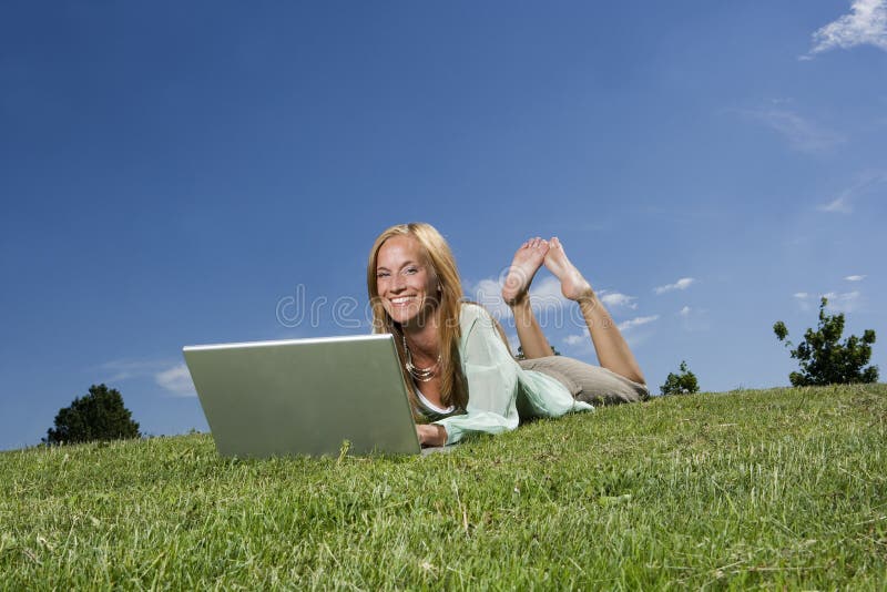 Woman with computer stock image. Image of blue, laptop - 27182359