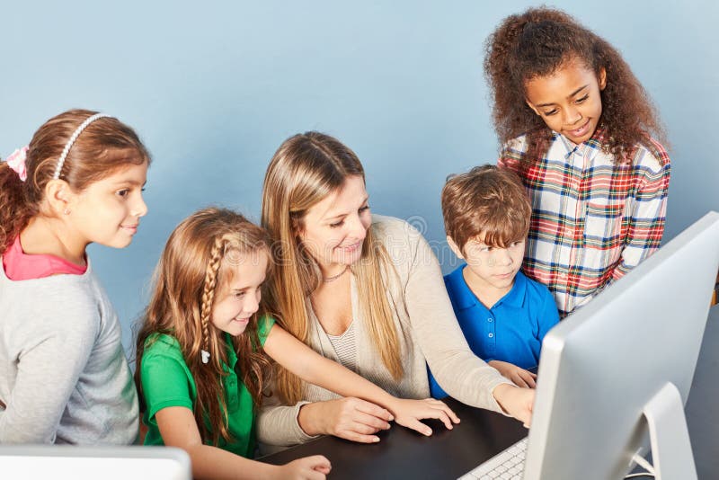 Woman at the Computer As a Teacher in Elementary School Stock Photo ...