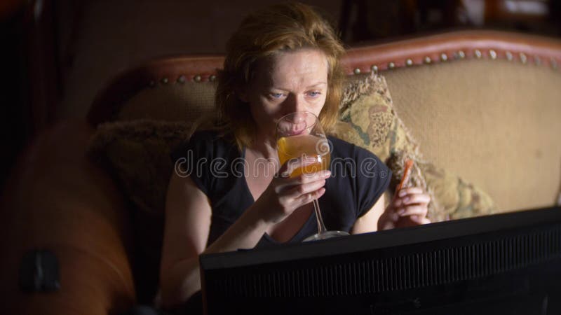 Woman with Computer, Drinking Beer at Home in the Dark. Stock Image ...