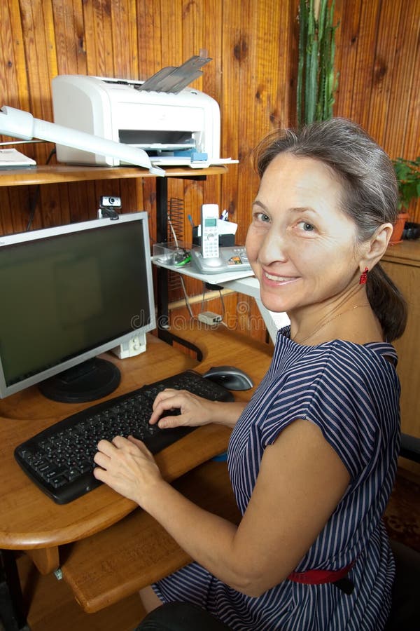 Woman at computer at home stock image. Image of life - 25505083