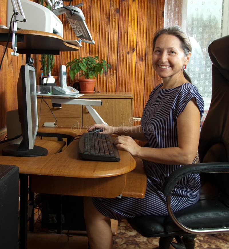 Woman at computer at home stock image. Image of business - 28698813