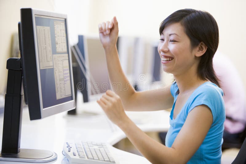 Woman in Computer Room Cheering and Smiling Stock Photo - Image of ...