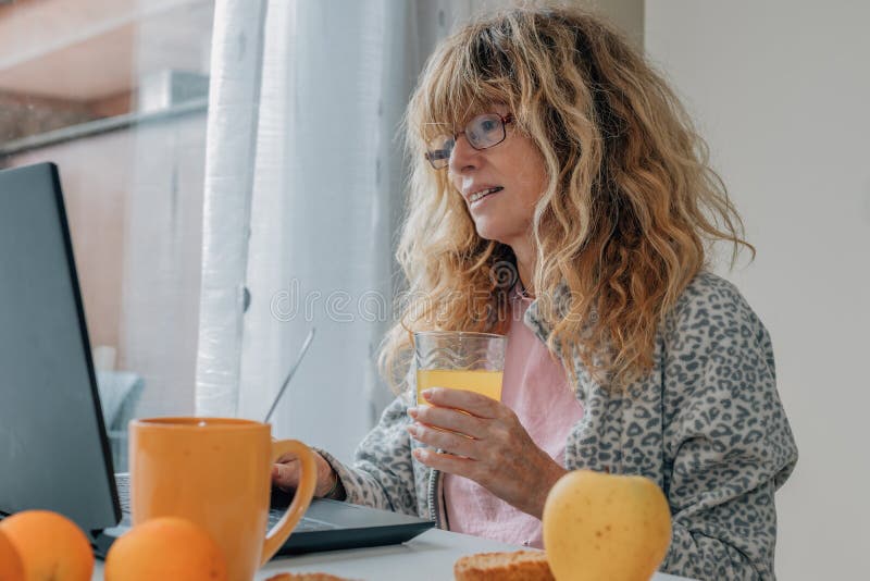 Woman with Computer Working at Home Having Breakfast Stock Image ...