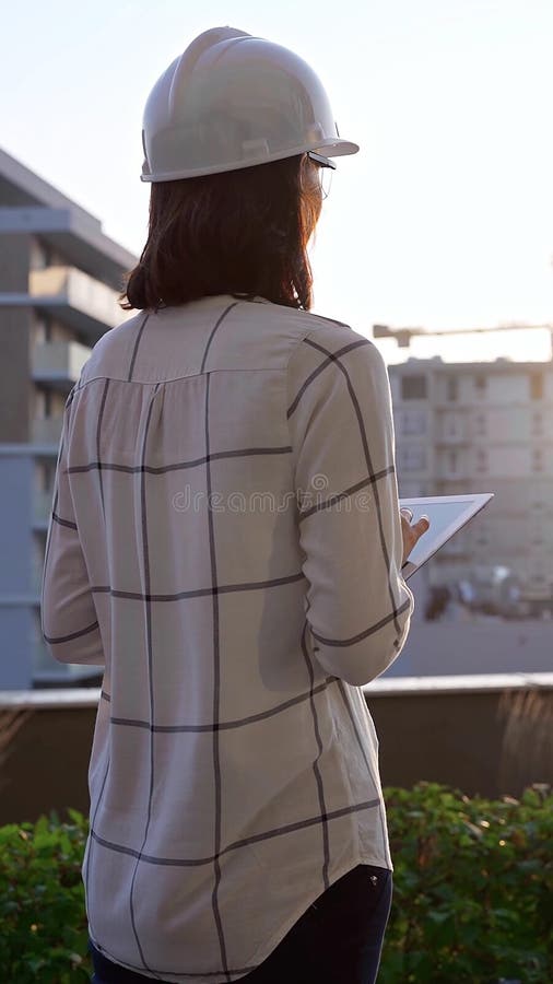 Woman a Construction Engineer Wearing White Checked Blouse and Hard Hat ...