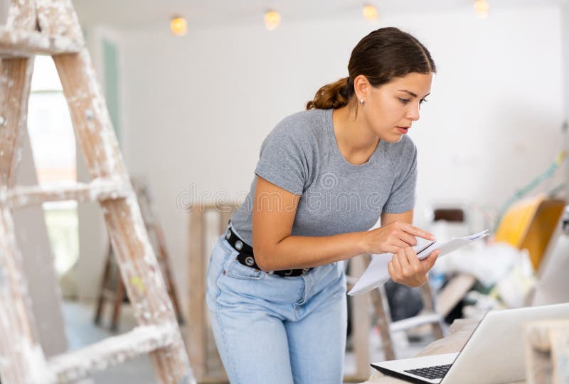 Woman Construction Manager Checking Project Documentation, Using Laptop Stock Image - Image of ...