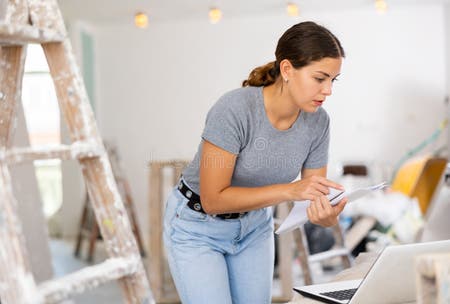 Woman Construction Manager Checking Project Documentation, Using Laptop Stock Image - Image of ...