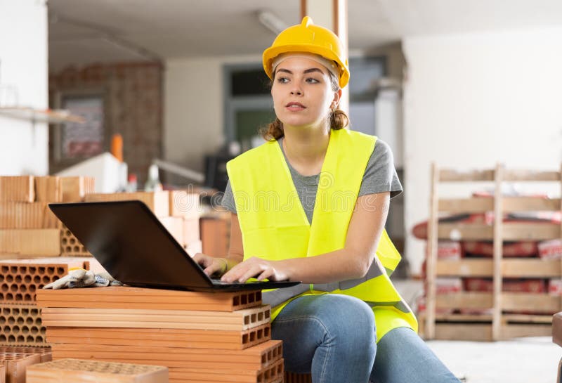 Woman Construction Worker Using Laptop in Apartment Stock Photo - Image ...