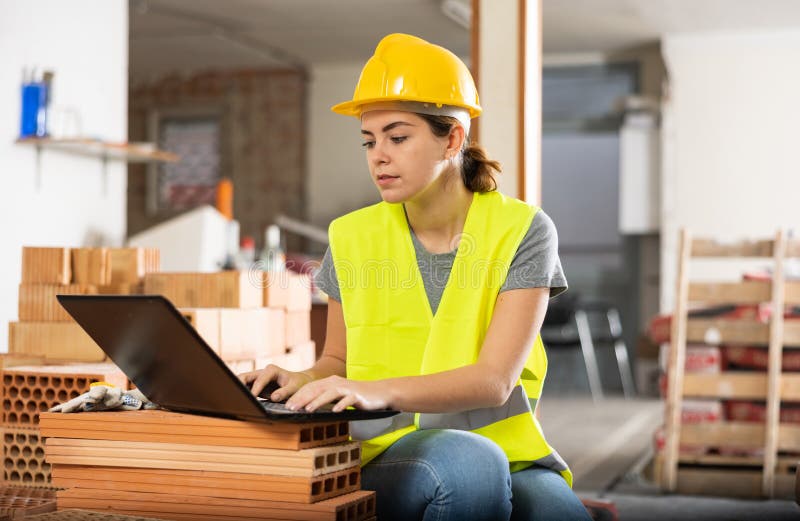 Woman Construction Worker Using Laptop in Apartment Stock Image - Image ...