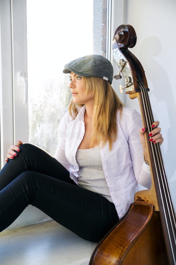 Woman with Contrabas Thinking about Something Seriously Stock Image ...