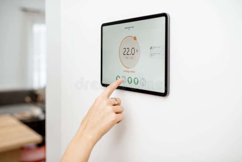 Woman Controlling Heating with a Smart Devices Stock Photo - Image of ...