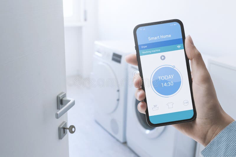 Woman Controlling Her Washing Machine from Her Phone Stock Photo ...