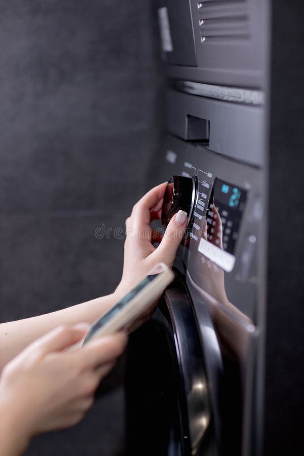 Woman Controls Washing Machine Phone Stock Photos - Free & Royalty-Free ...