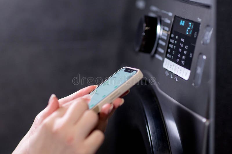 Woman Controls Washing Machine Phone Stock Photos - Free & Royalty-Free ...