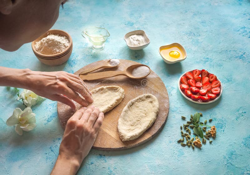 Woman Cook Makes Hand Cakes with Fresh Strawberries. Stock Image ...