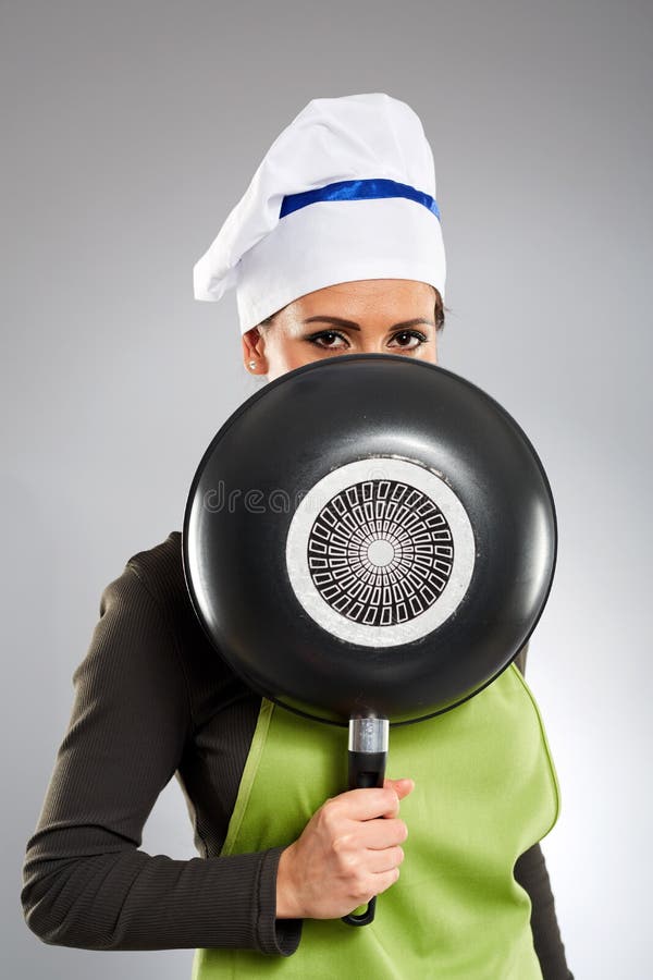 Woman cook with a wok stock image. Image of cook, face - 72046793
