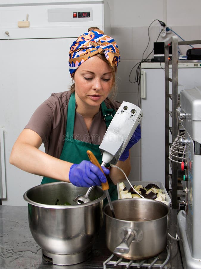 Woman cook working stock photo. Image of handling, stove - 75027320