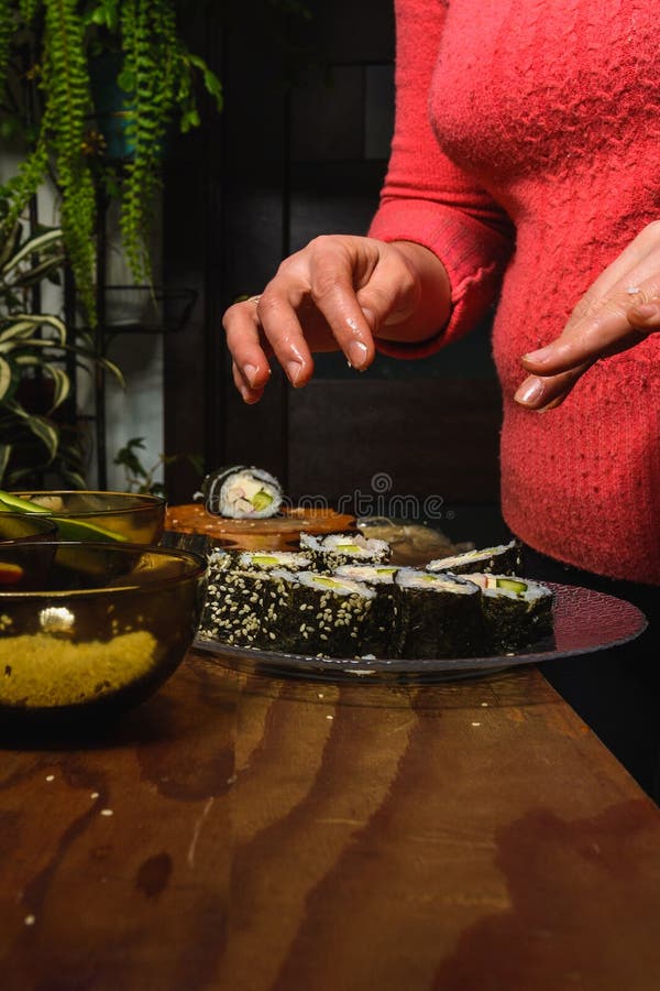 The Woman Cooked Sushi and Placed Them on a Round Plate Stock Photo ...