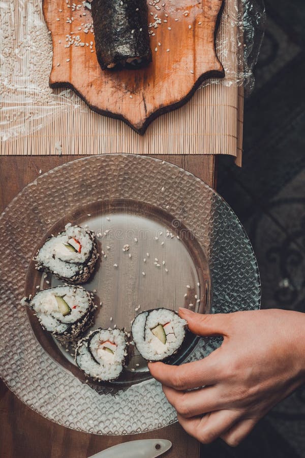The Woman Cooked Sushi and Placed Them on a Round Plate Stock Photo ...