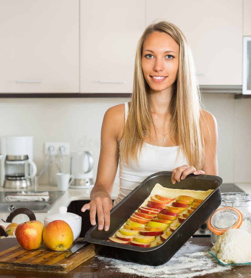 Woman cooking apple pie stock photo. Image of kitchen - 55605844