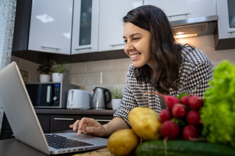Woman Cooking Checking Recipe at Laptop Stock Photo - Image of health ...