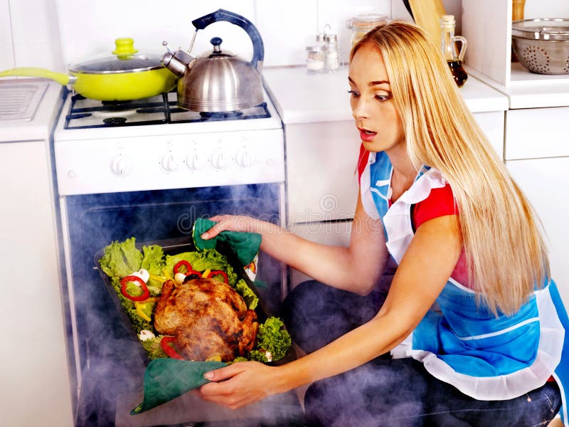Woman Cooking Chicken at Kitchen. Stock Photo - Image of delicious ...