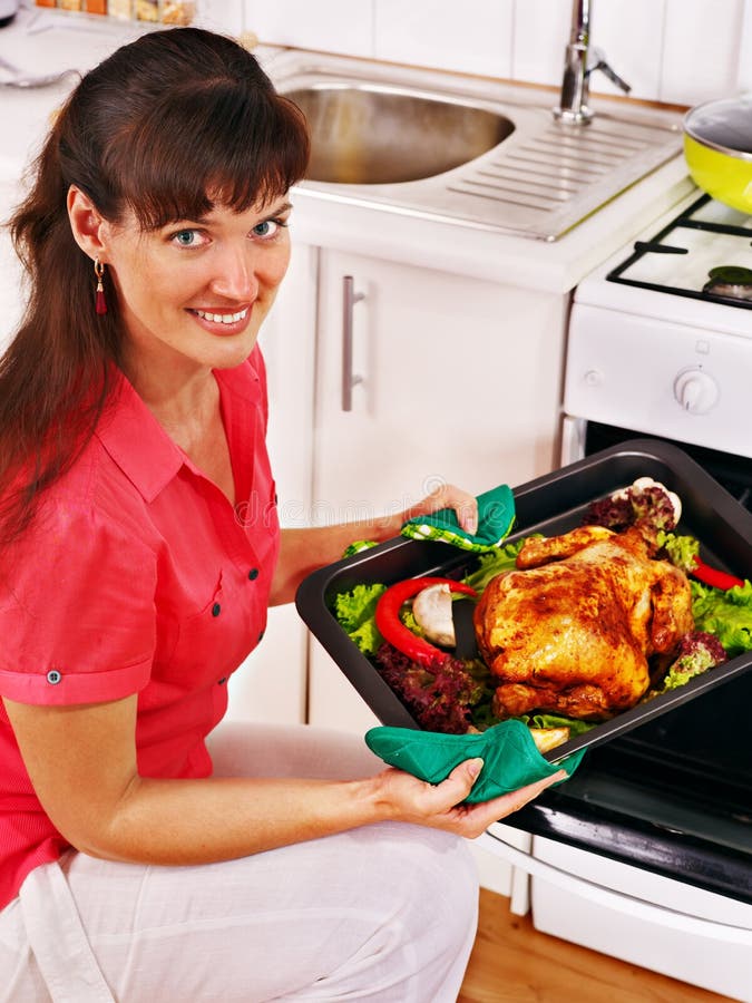 Woman Cooking Chicken at Kitchen. Stock Photo - Image of party ...