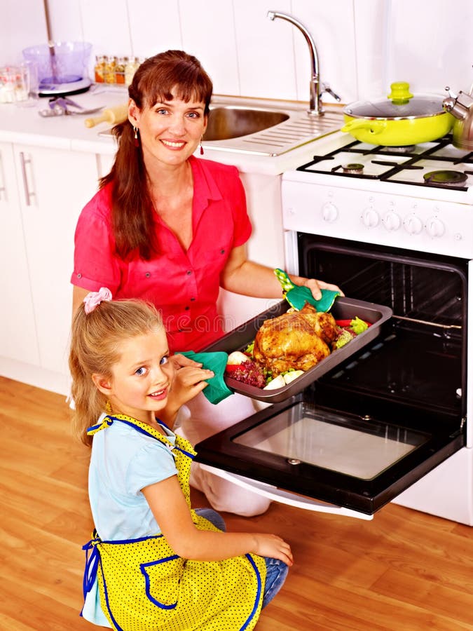 Woman Cooking Chicken at Kitchen. Stock Photo - Image of housewife ...