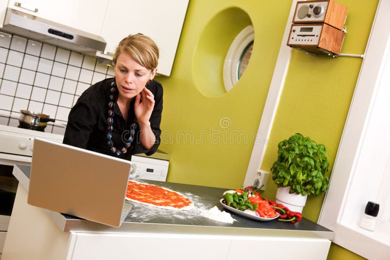 Woman Cooking with Computer Stock Photo - Image of homemade, home: 3193010