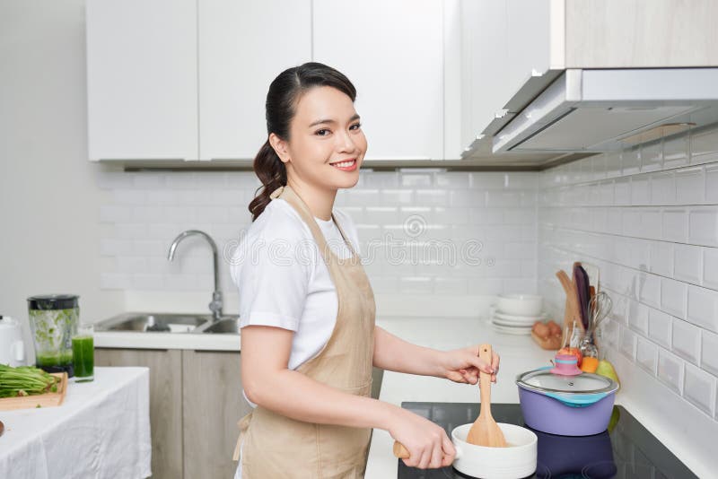 Woman Cooking Delicious Dinner at Home Stock Image - Image of cooking ...