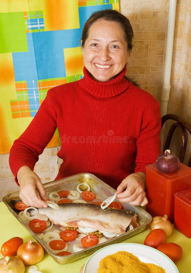 Woman cooking fish stock photo. Image of spices, female - 16463670