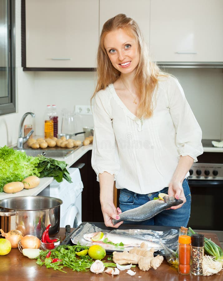 Woman Cooking Fish In Sheet Pan Stock Photo - Image of person ...