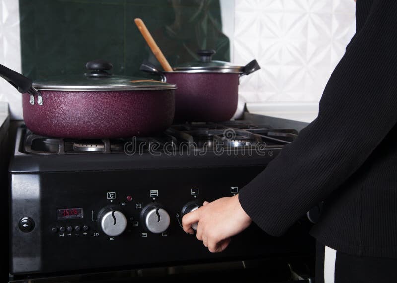 Woman is Cooking on the Gas in the Kitchen Stock Photo - Image of stove ...