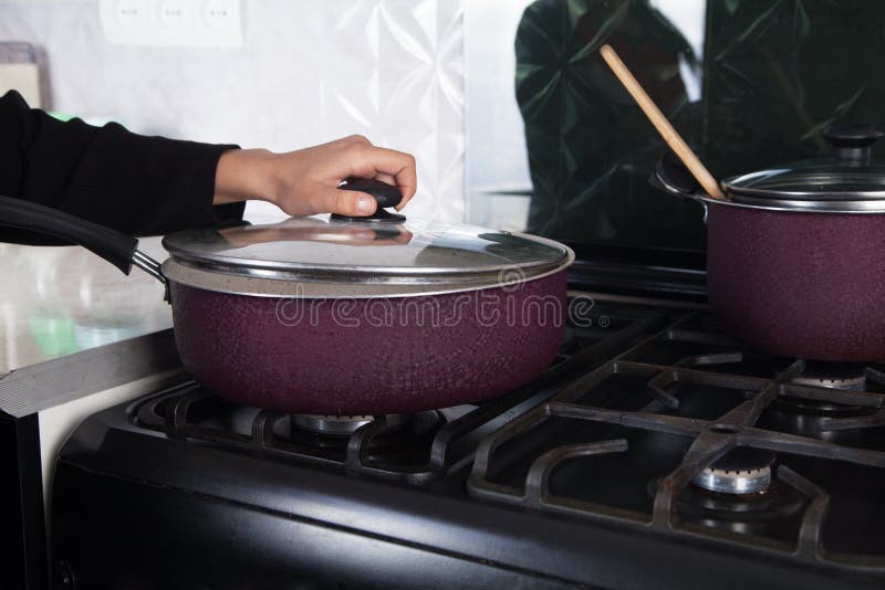 Woman is Cooking on the Gas in the Kitchen Stock Image - Image of ...