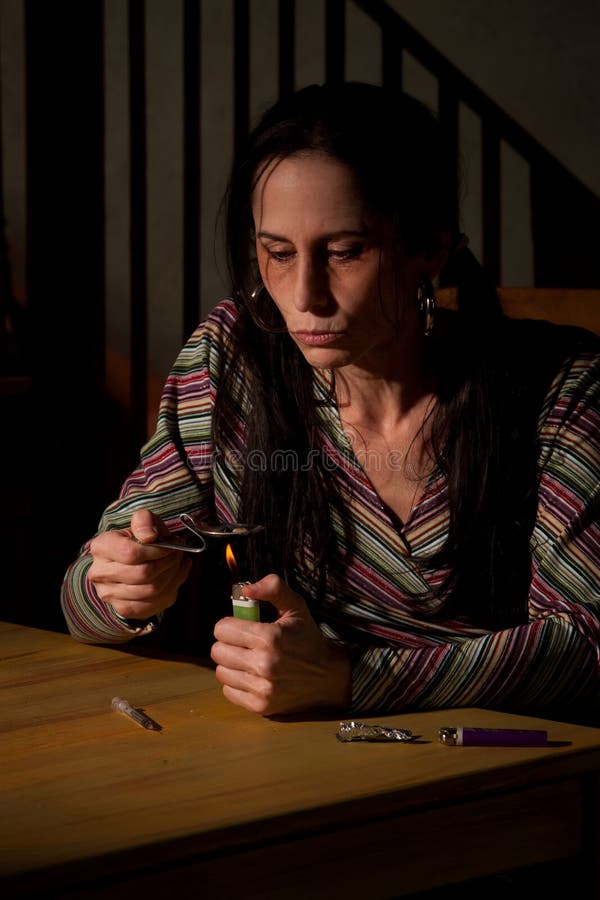 Woman Cooking Heroin in a Spoon Stock Image - Image of horse, shadow ...