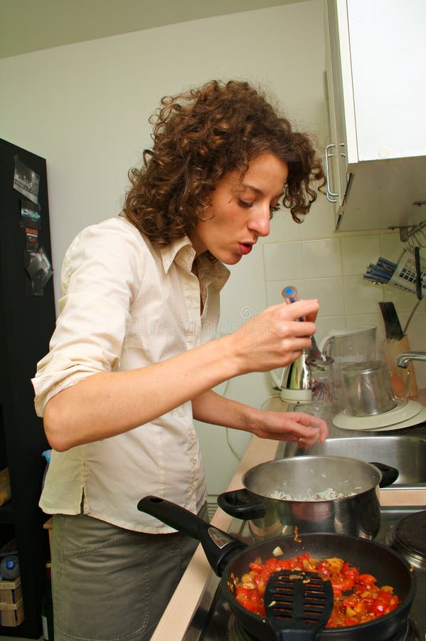 Woman cooking at home stock image. Image of color, preparations - 7653235