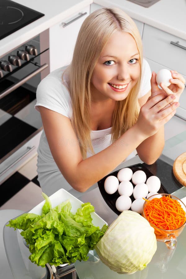 Woman cooking at home stock image. Image of eggs, cook - 86390219