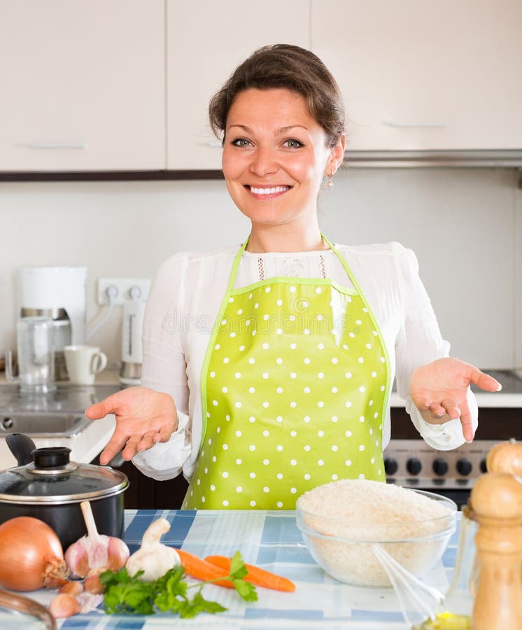 Woman Cooking Rice in the Kitchen Stock Photo - Image of cook ...