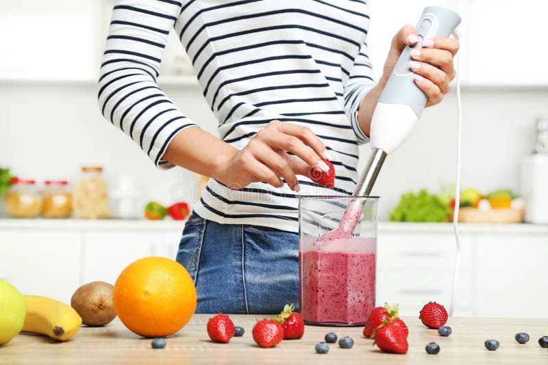 Woman cooking smoothie stock image. Image of people, meal - 98491087