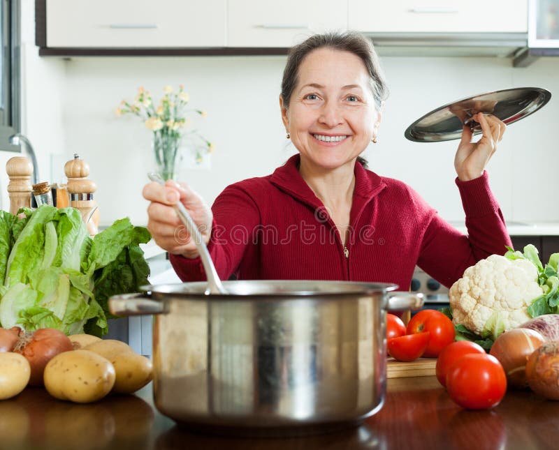 Woman cooking soup stock image. Image of portrait, veggy - 60762835
