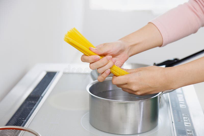 Cooking Spaghetti in the Kitchen Stock Photo - Image of casual, staple ...