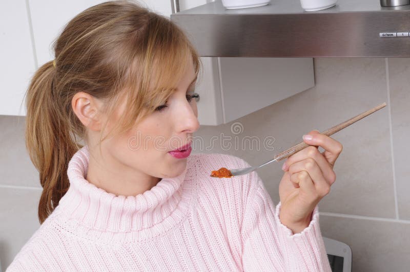 Woman cooking a tasty meal stock photo. Image of adult - 9248134