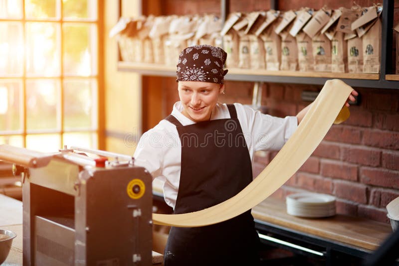 Woman Cooks Dough on Machine for Making Pasta Stock Image - Image of ...