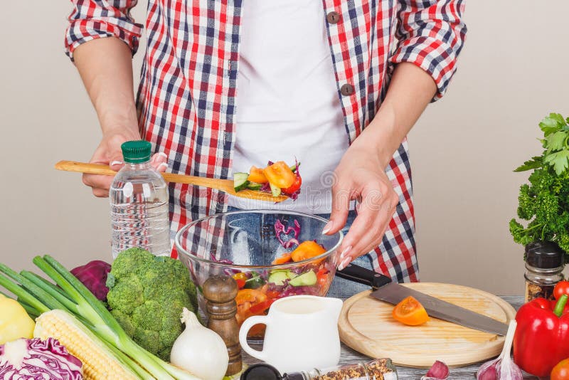 Woman Cooks at the Kitchen, Body Part, Blurred Background Stock Photo ...