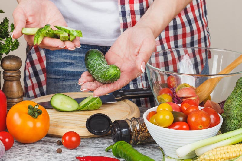 Woman Cooks at the Kitchen, Body Part, Blurred Background Stock Photo ...