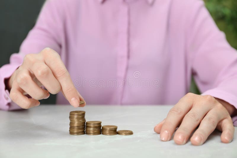 Woman Counting Coins at Light Table Stock Photo - Image of currency ...