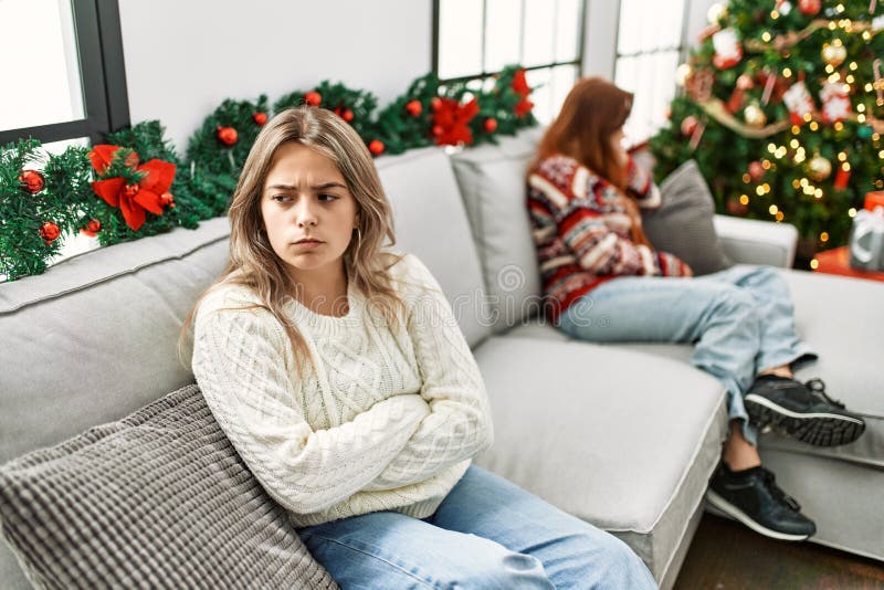 Woman Couple Angry with Problems Sitting by Christmas Tree at Home ...